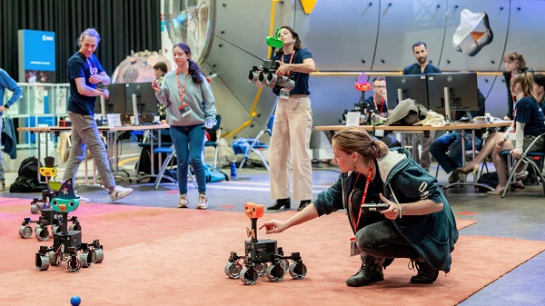 Students work 3D-printed ExoMy rovers on Mars